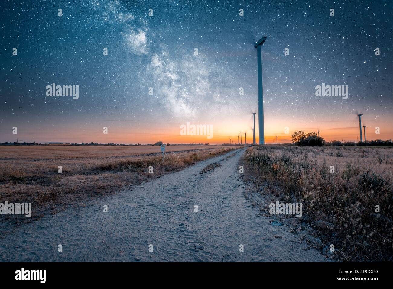 A beautiful view of a path in the middle of a field and stars in the ...
