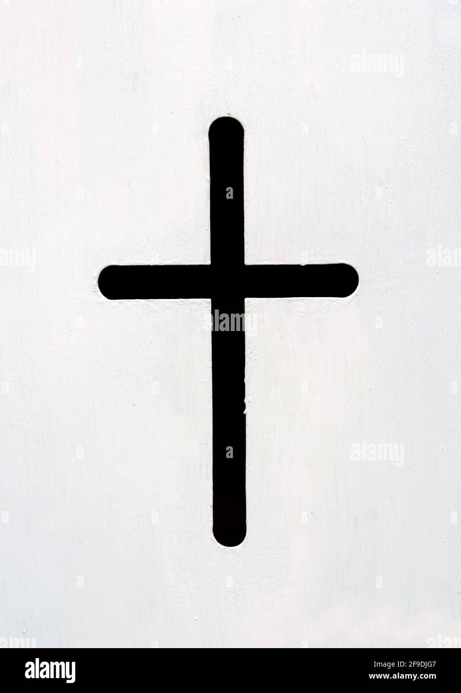 A simple black cross isolated on white background Stock Photo - Alamy