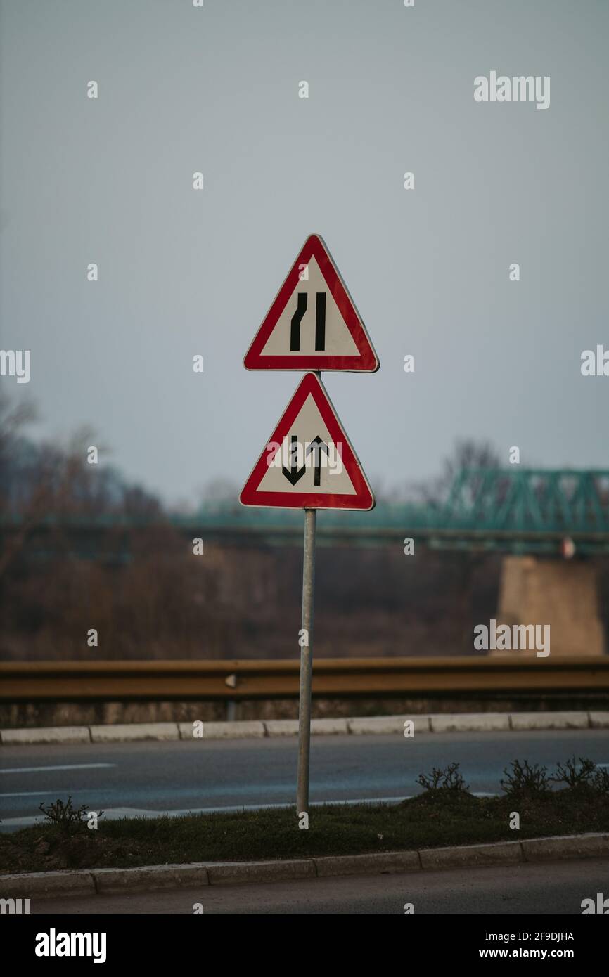 A vertical shot of two traffic signs on the street Stock Photo - Alamy