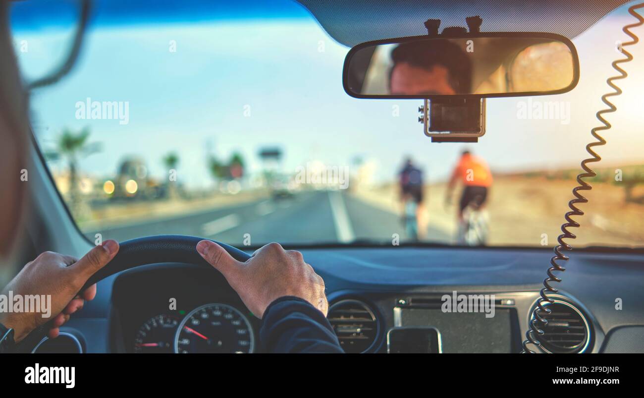 Cyclists with cars and action competition hi-res stock photography and ...