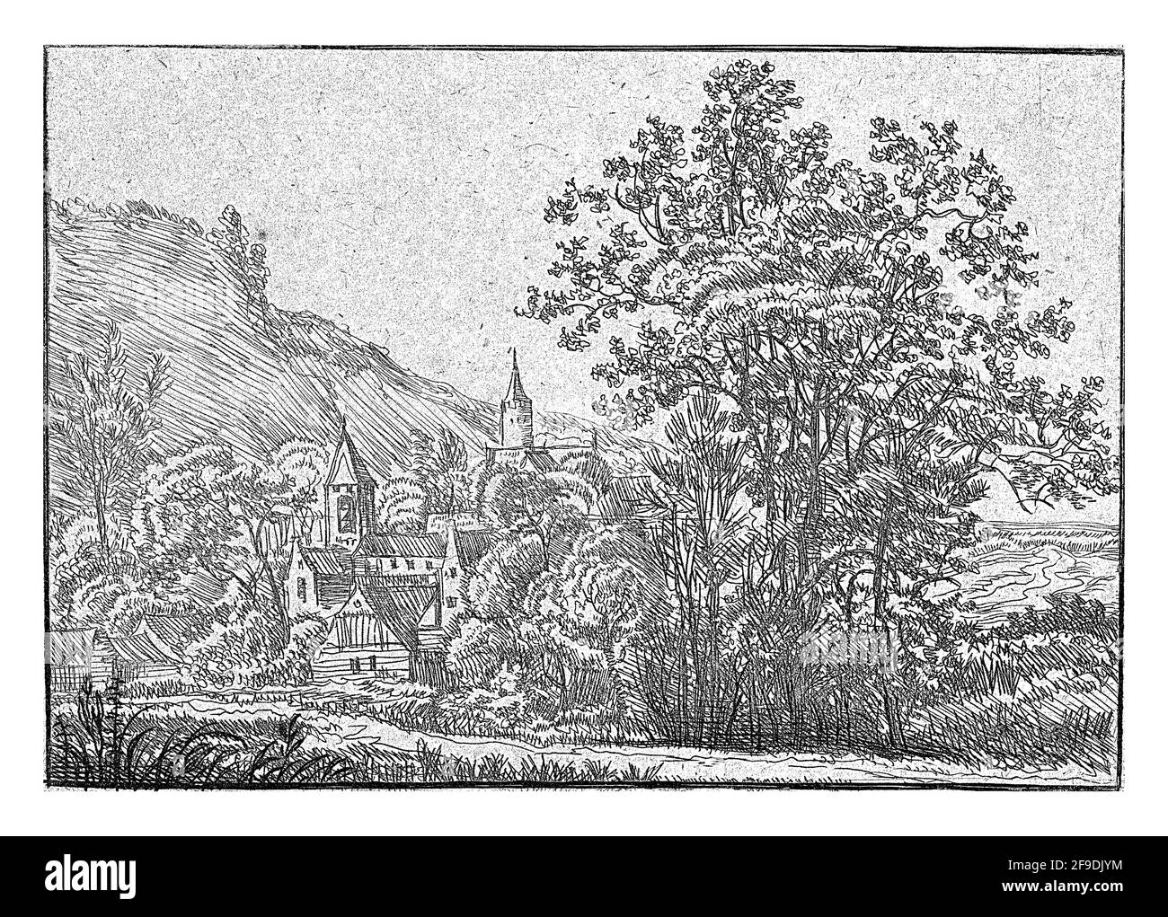 A village of two buildings with tall towers at the bottom of a hill ...