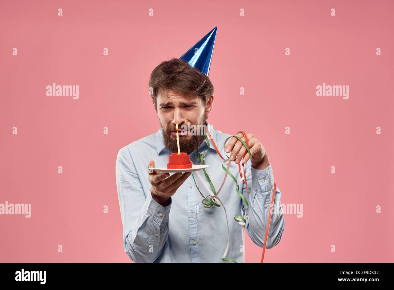 Man birthday party cake with candle cap fun Stock Photo - Alamy