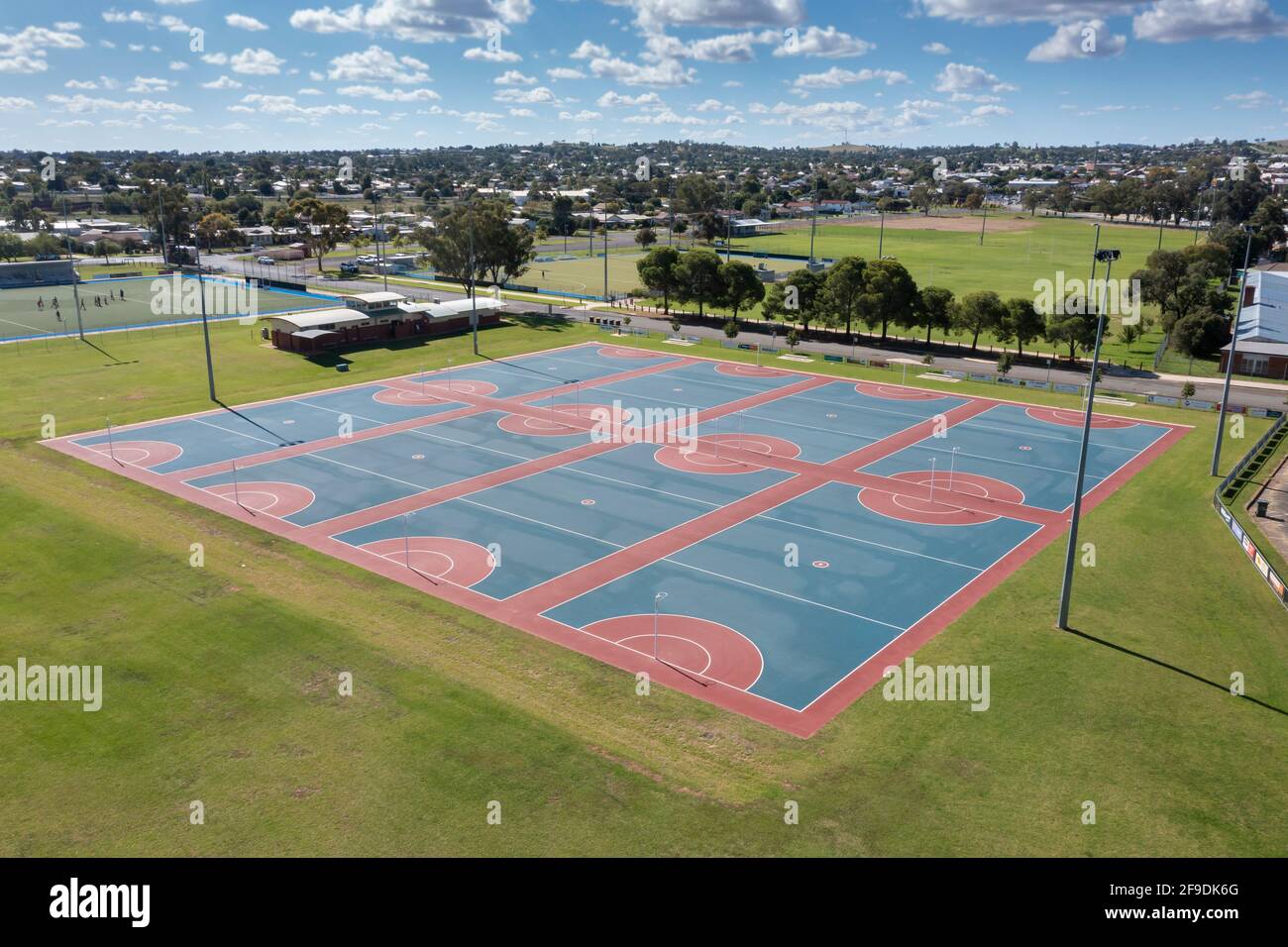 Drone aerial photograph of colourful netball courts and large sports ...