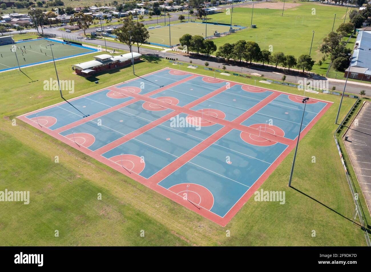 Drone aerial photograph of colourful netball courts and large sports ...