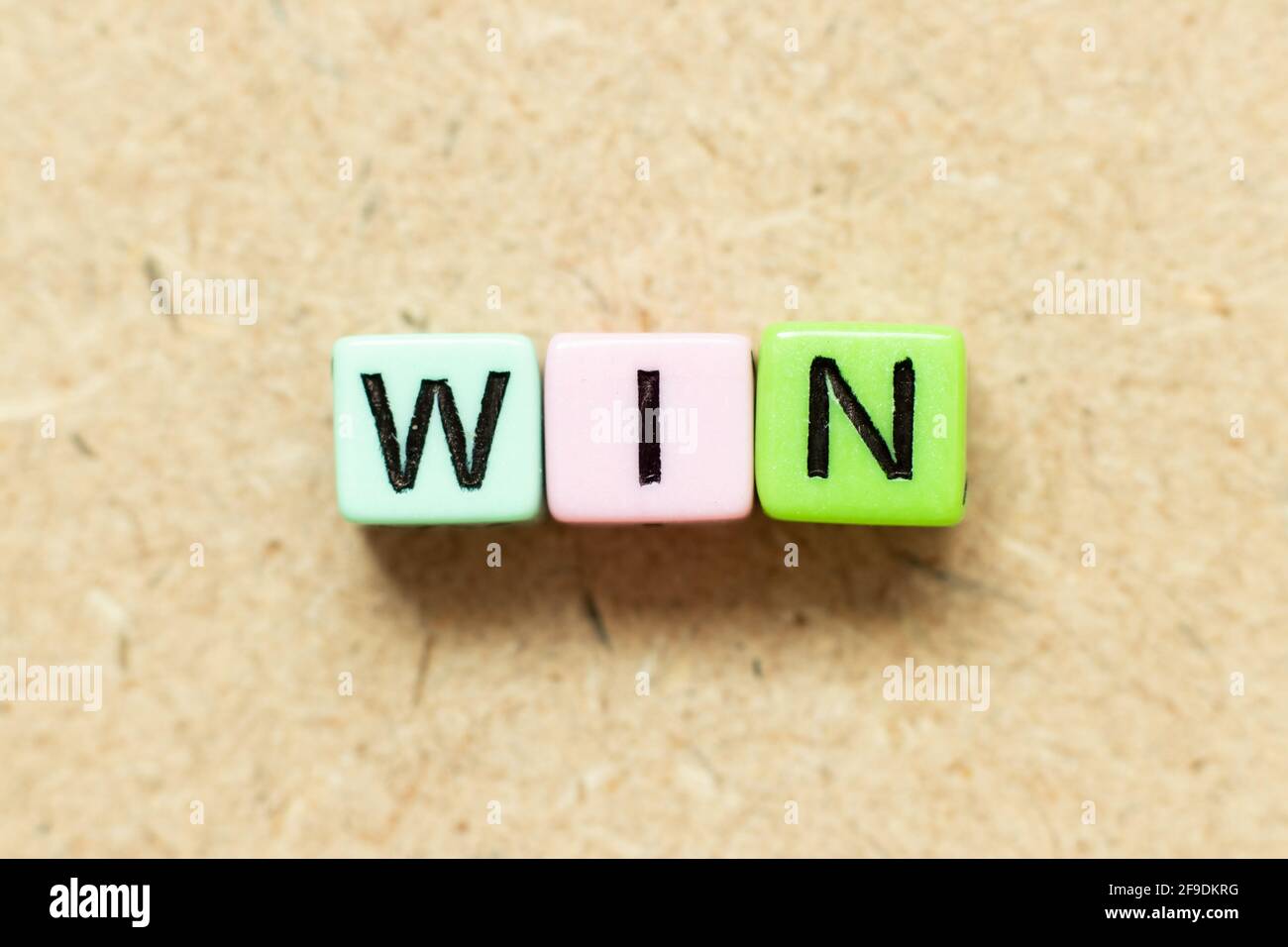 Color alphabet letter block in word win on wood background Stock Photo ...