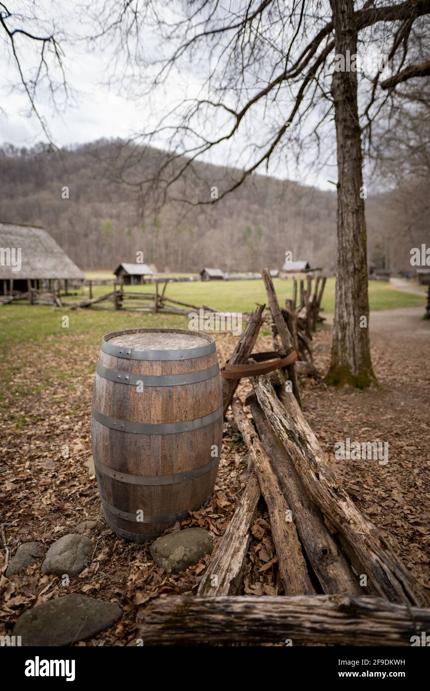 barrel next to a rustic fence in a historic site Stock Photo - Alamy