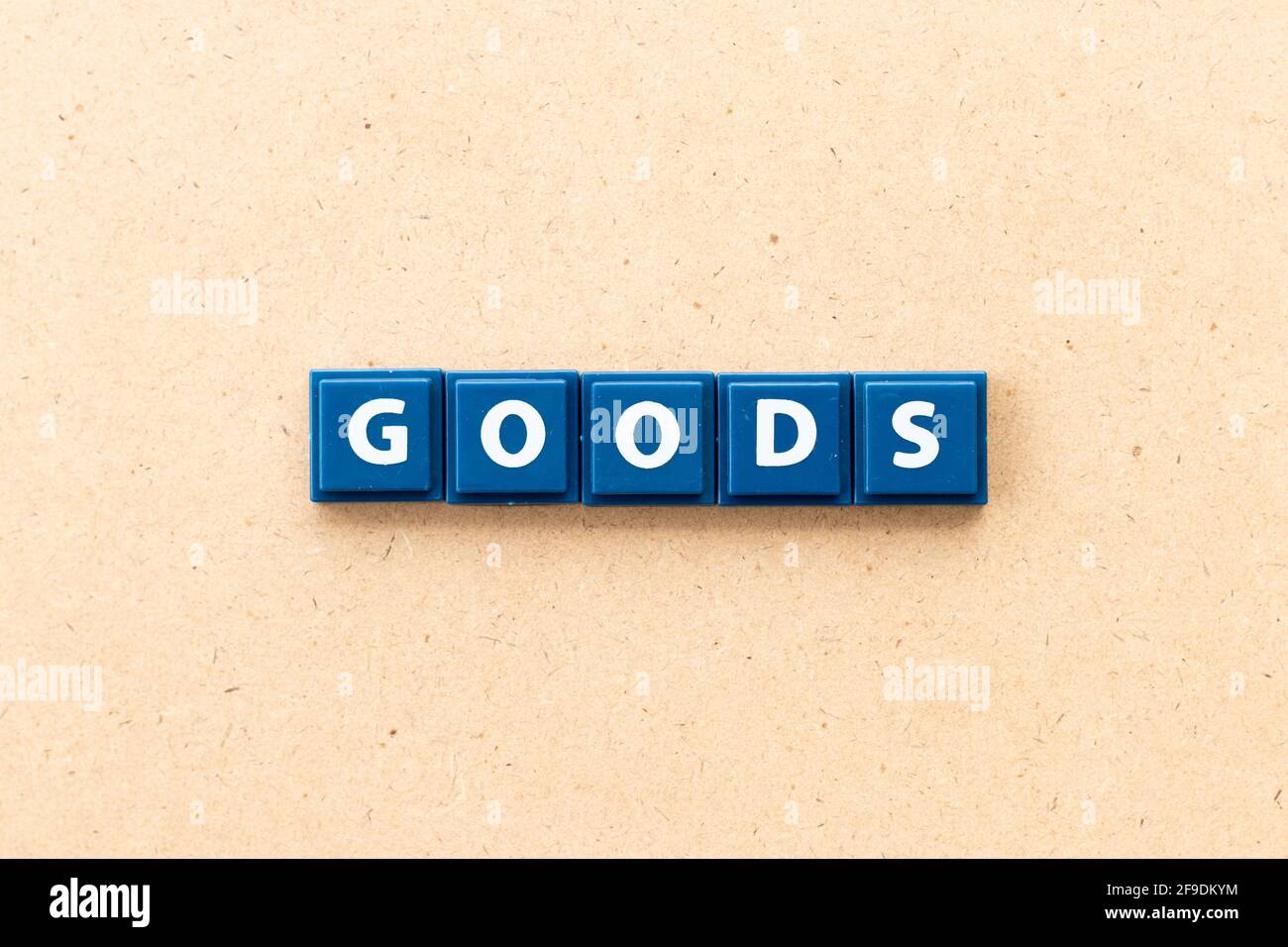Tile letter in word goods on wood background Stock Photo - Alamy