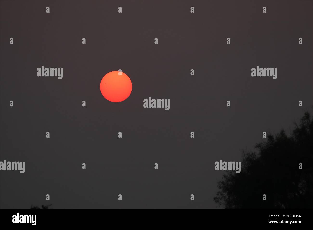 The view of the sun setting with bright light, India Stock Photo - Alamy