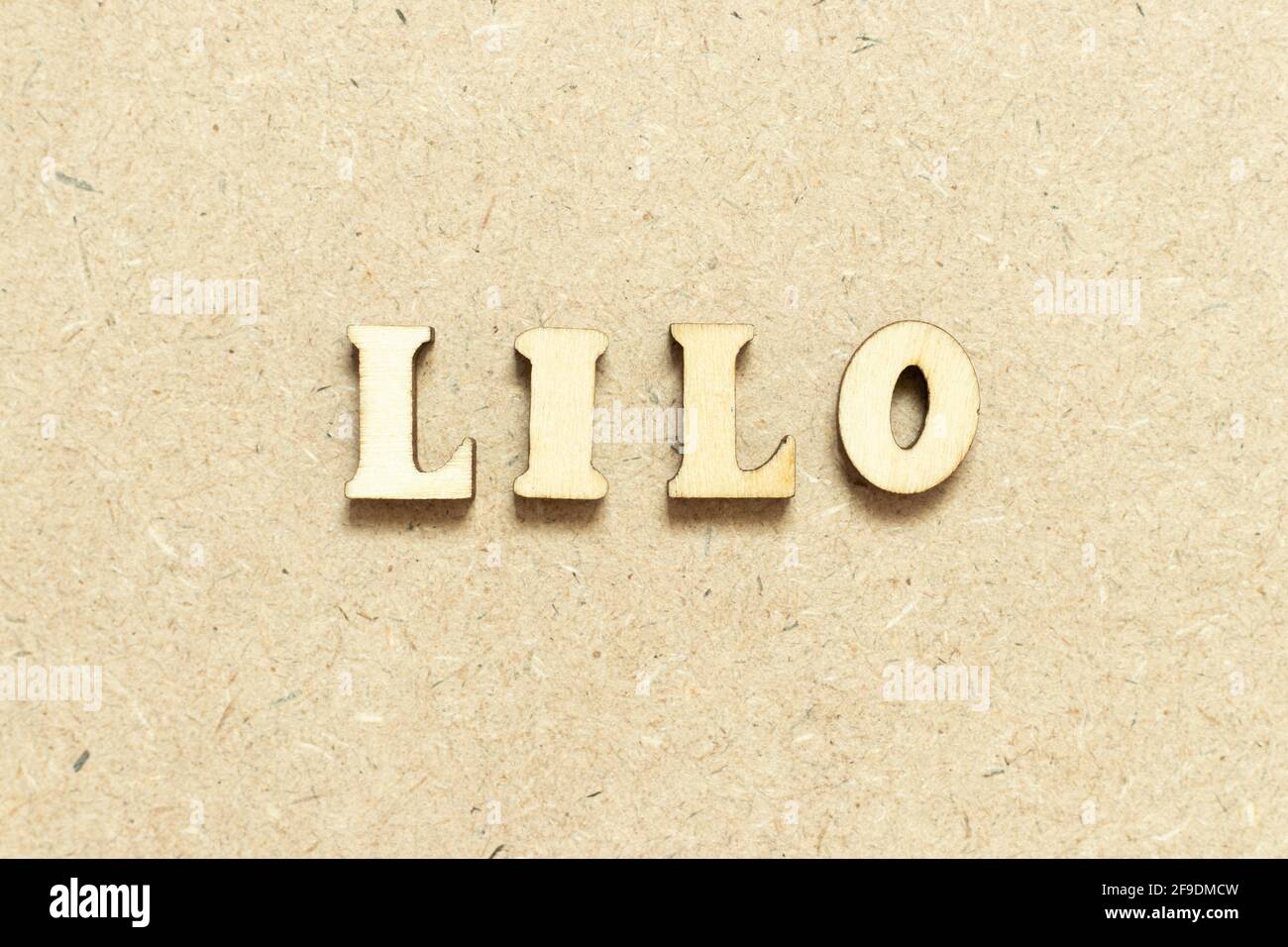 Alphabet letter in word LILO (abbreviation of last in last out) on wood ...