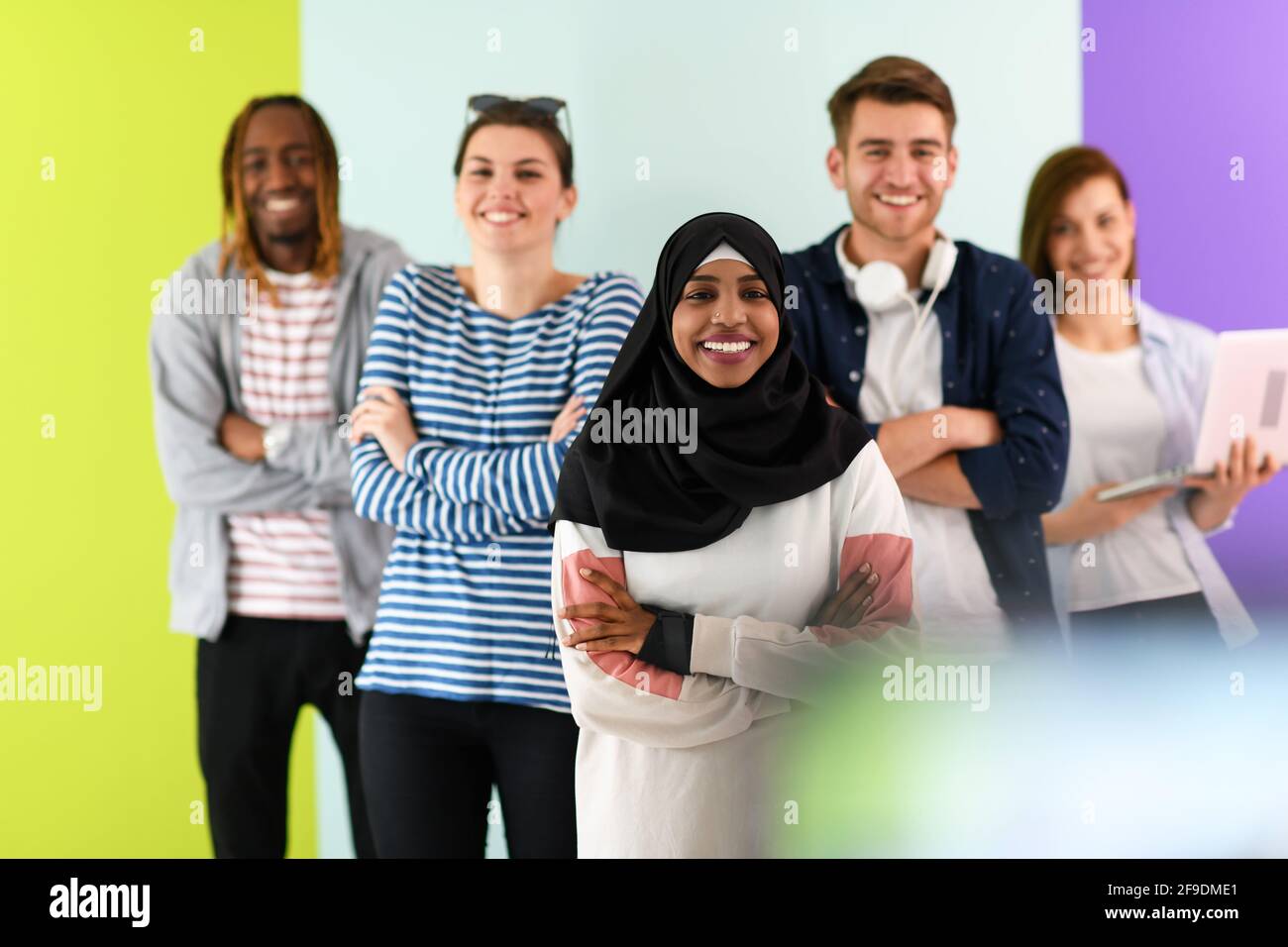 group of diverse teenagers posing in a studio, determined teenagers in ...