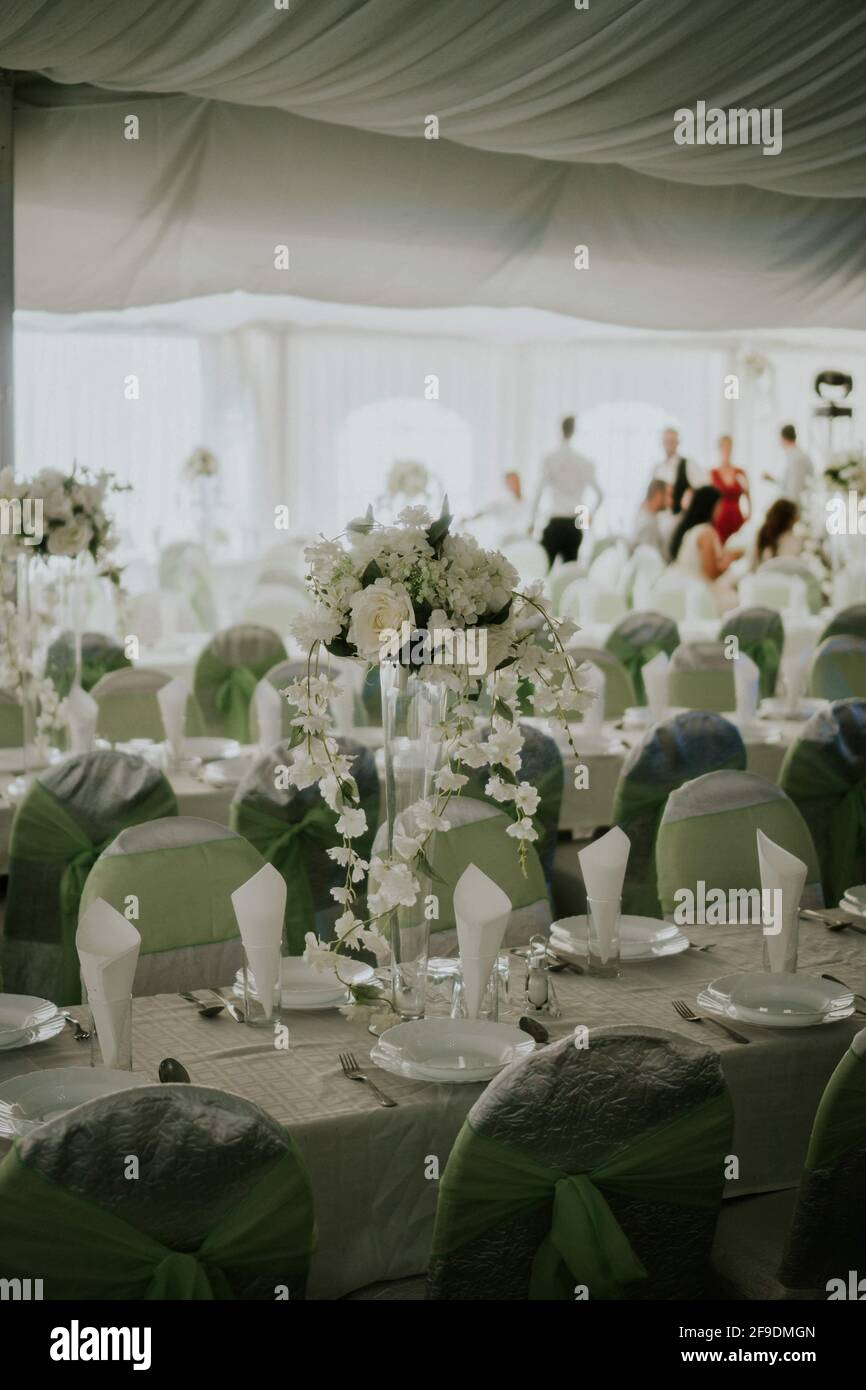 A vertical shot of a table setup at a wedding venue Stock Photo - Alamy