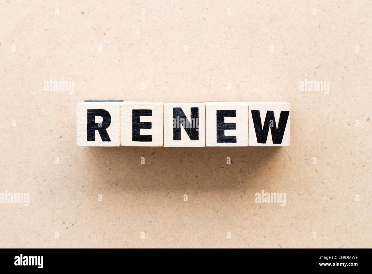 Letter block in word renew on wood background Stock Photo - Alamy