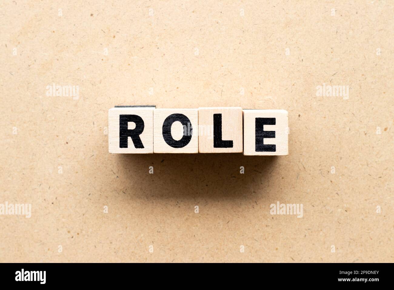 Letter block in word role on wood background Stock Photo - Alamy