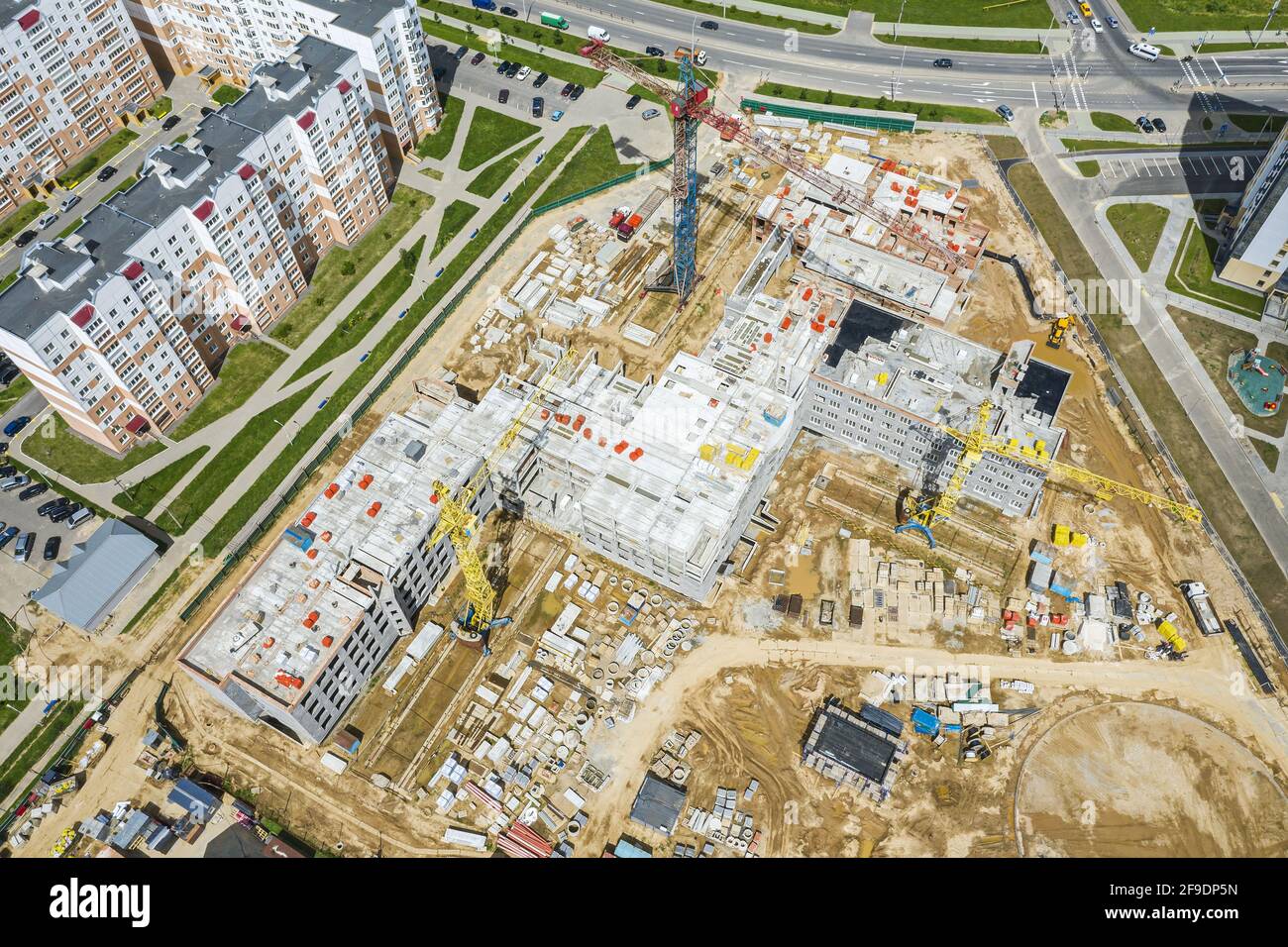 construction of new school building in residential area. aerial top ...