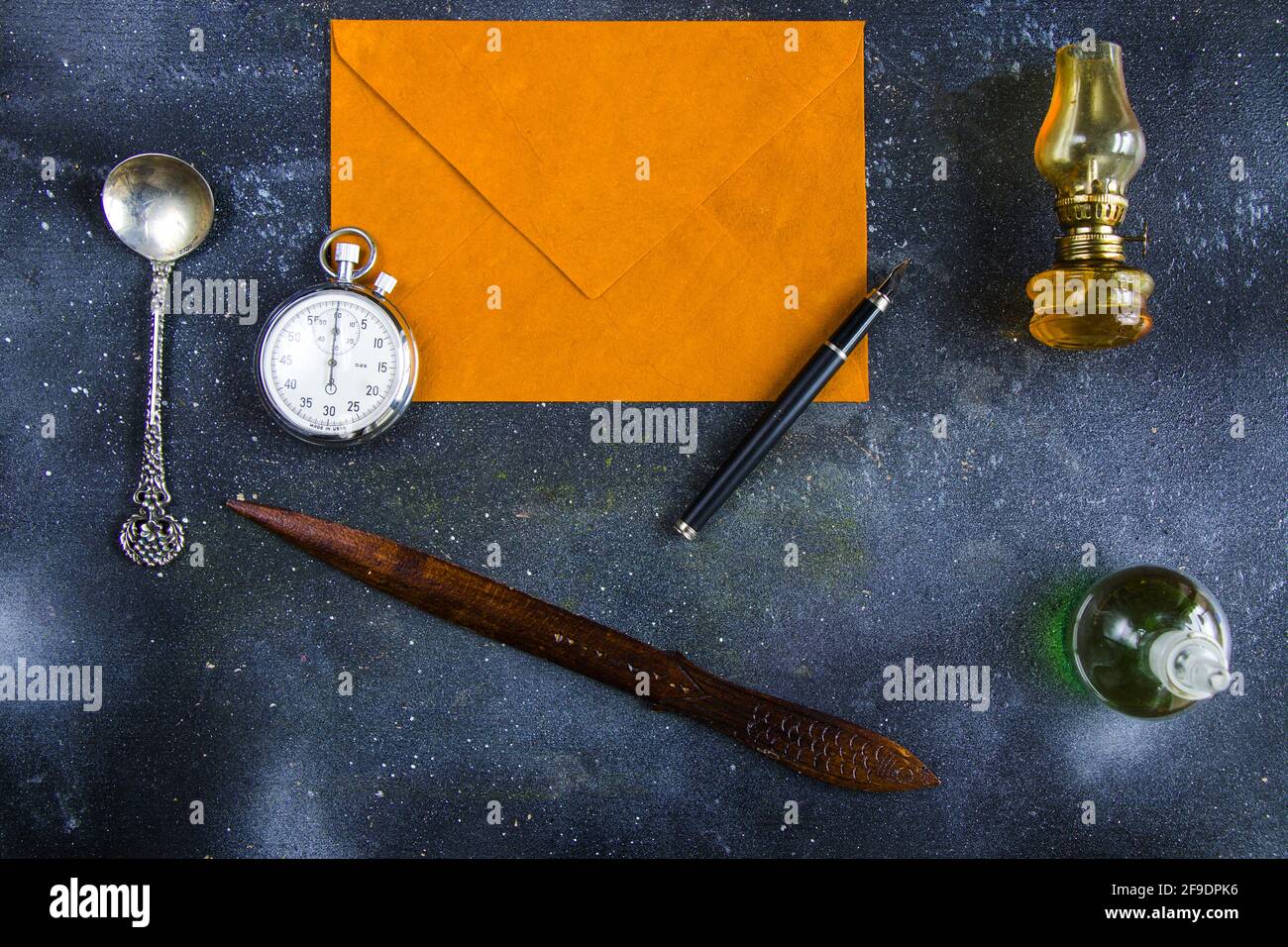 A top view of an envelope with a vintage fountain pen and a pocket ...