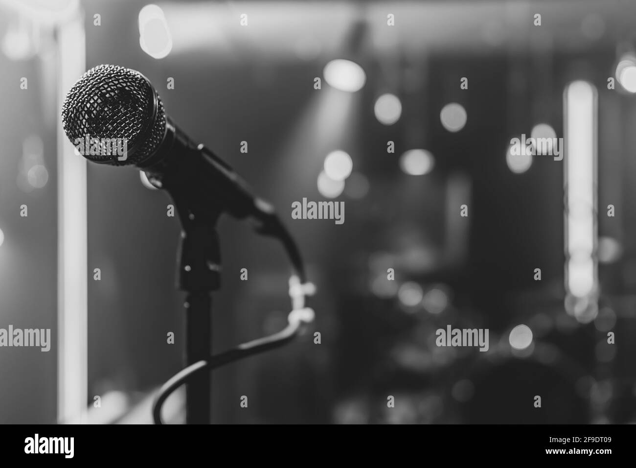 Close up of a microphone on a concert stage with beautiful lighting ...