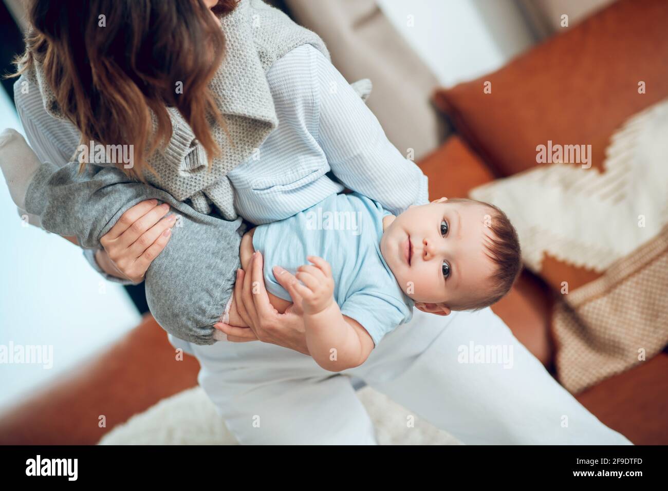 Baby in mothers arms hi-res stock photography and images - Alamy