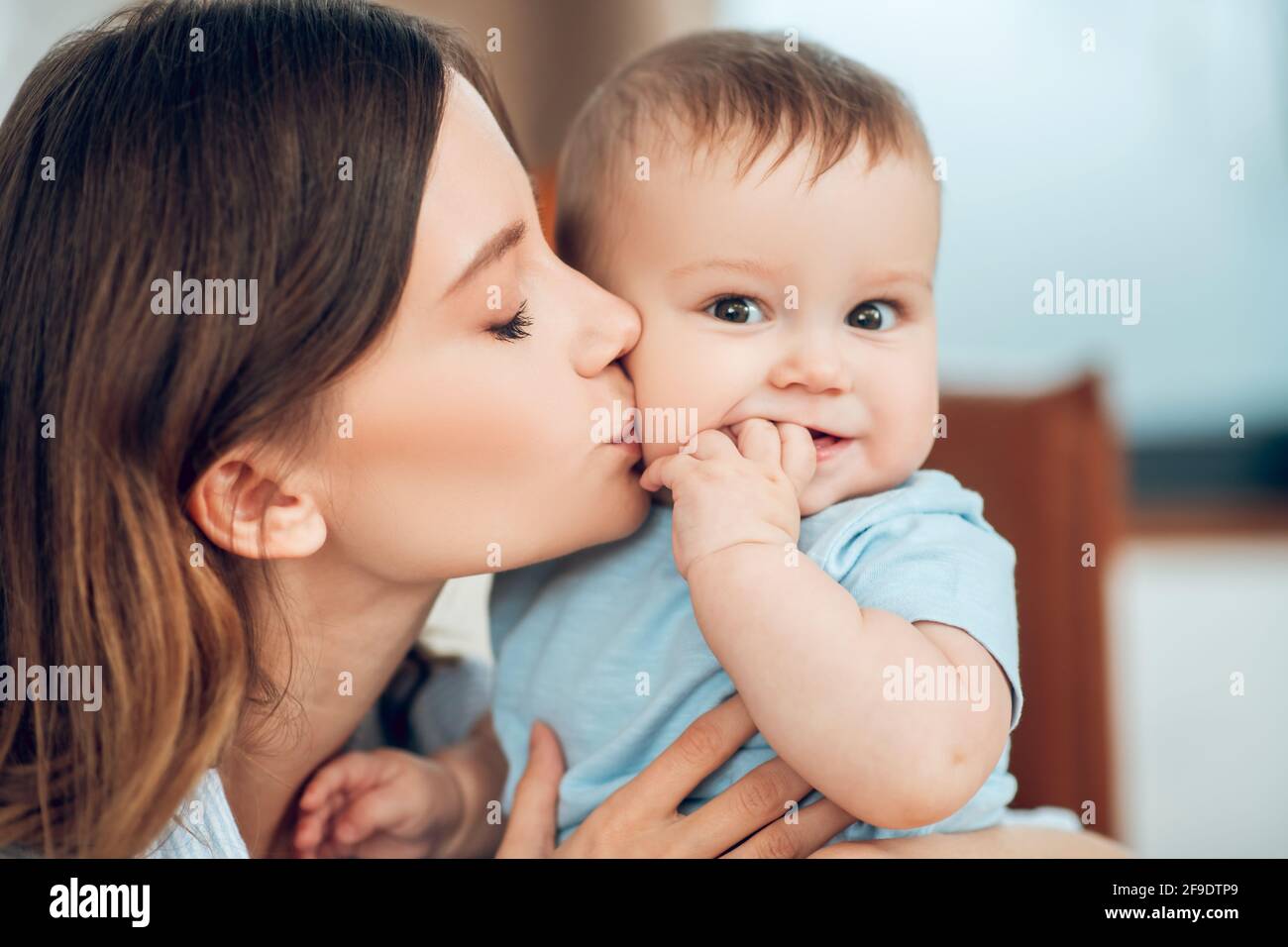 Finger touching baby cheek hi-res stock photography and images - Alamy