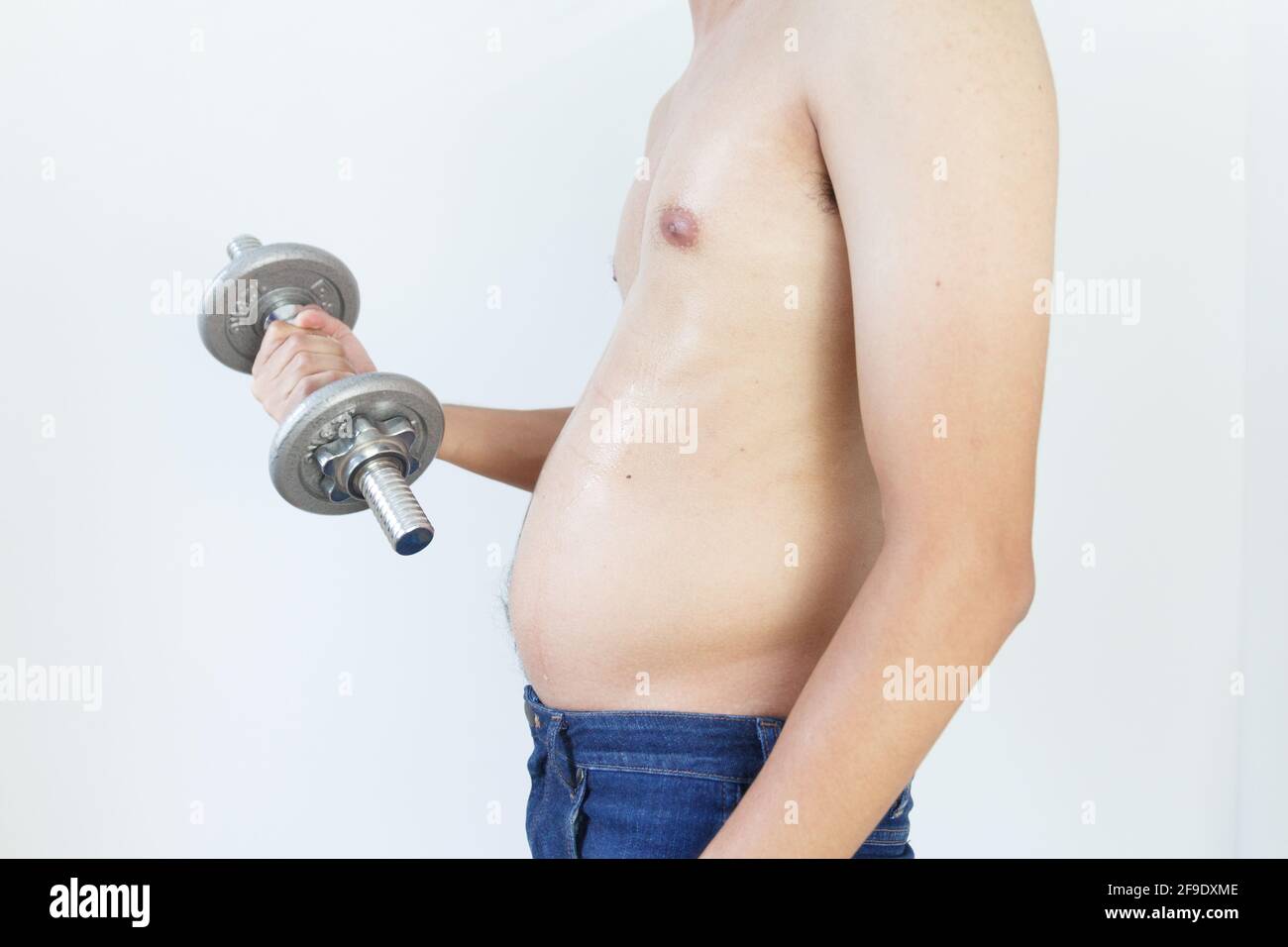 The paunchy fat man exercise for lose weight Stock Photo - Alamy