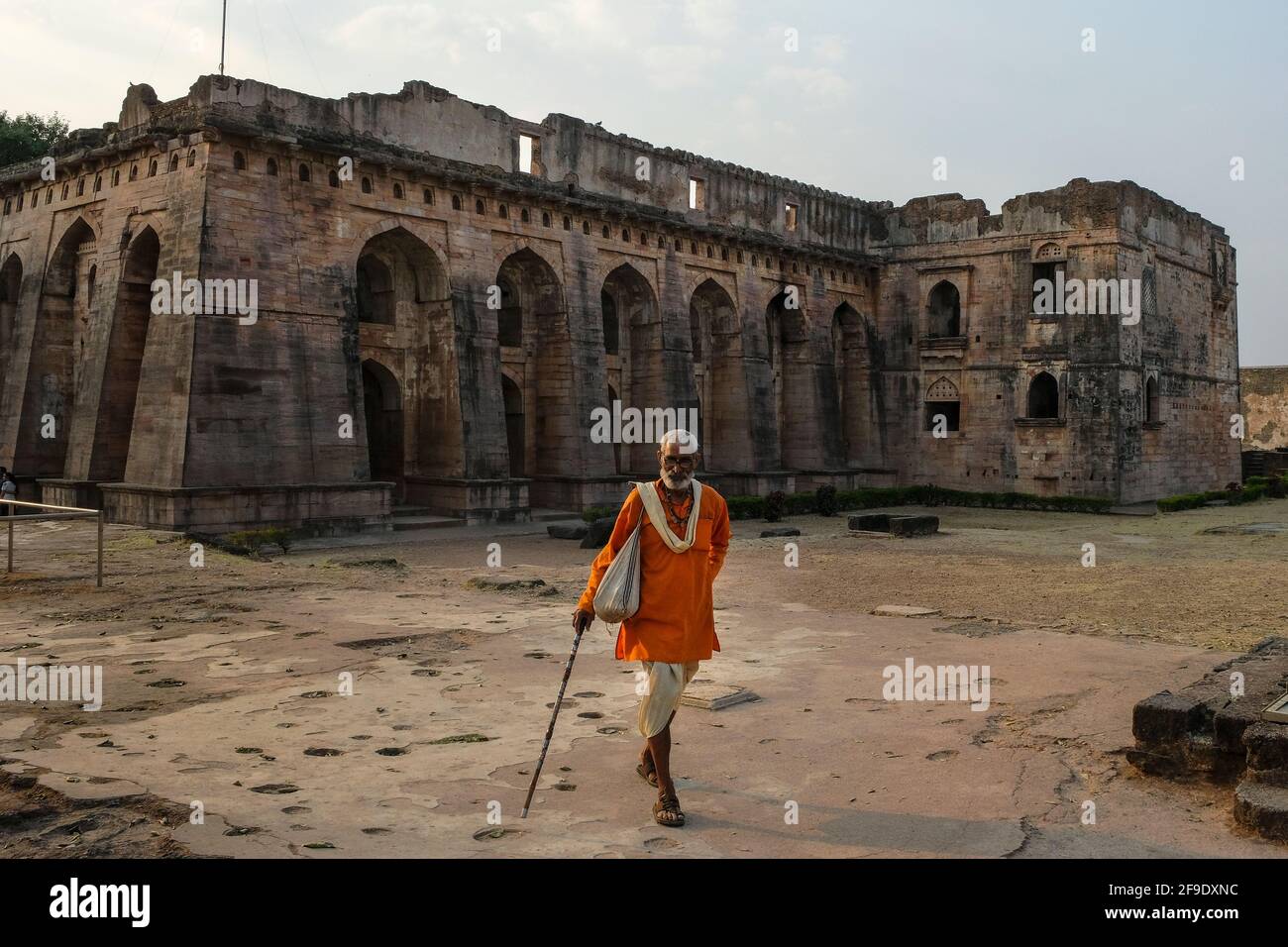 Mandu, India - March 2021: A man visiting the Hindola Mahal. It is a ...