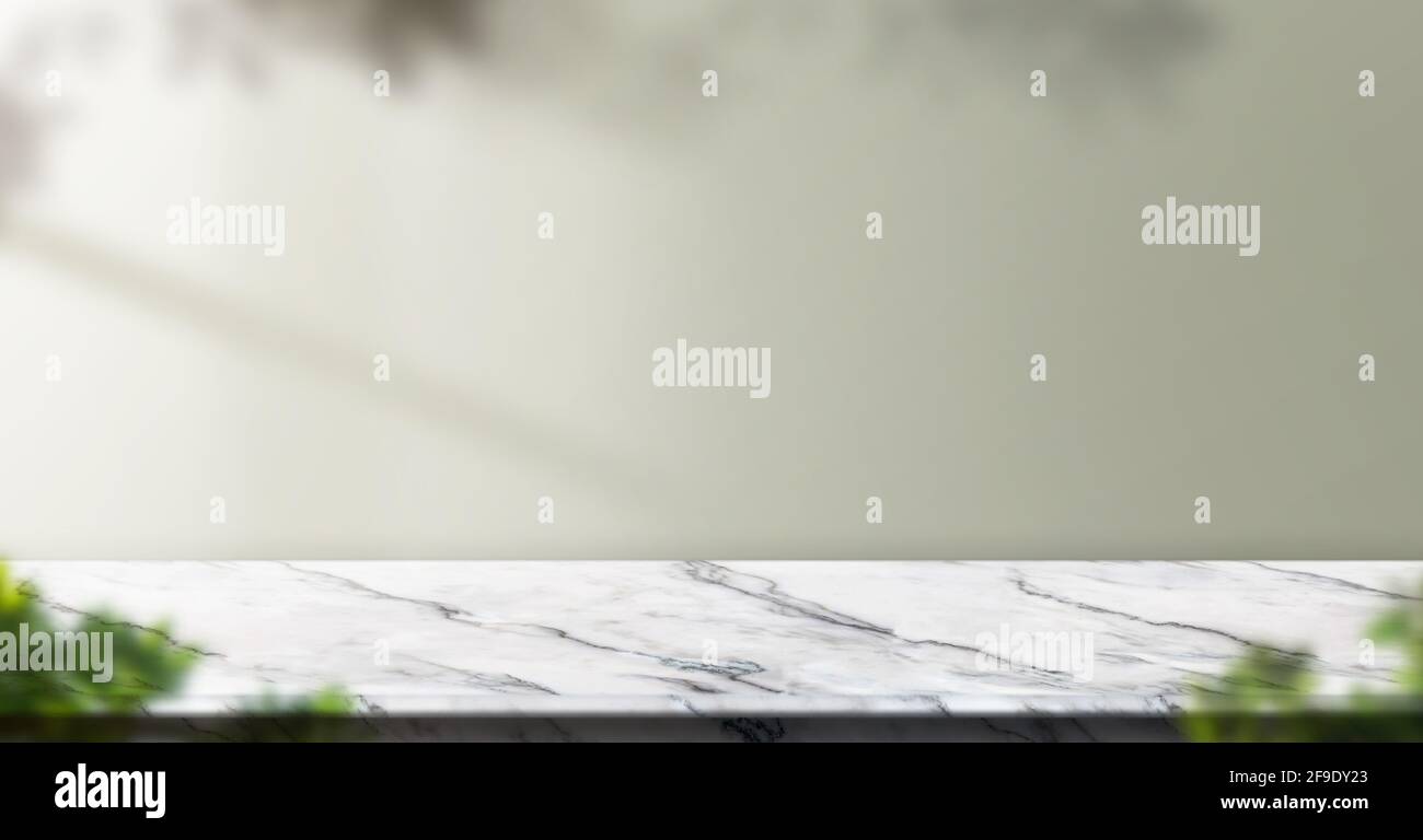 marble table background with sunlight window create leaf shadow on wall ...