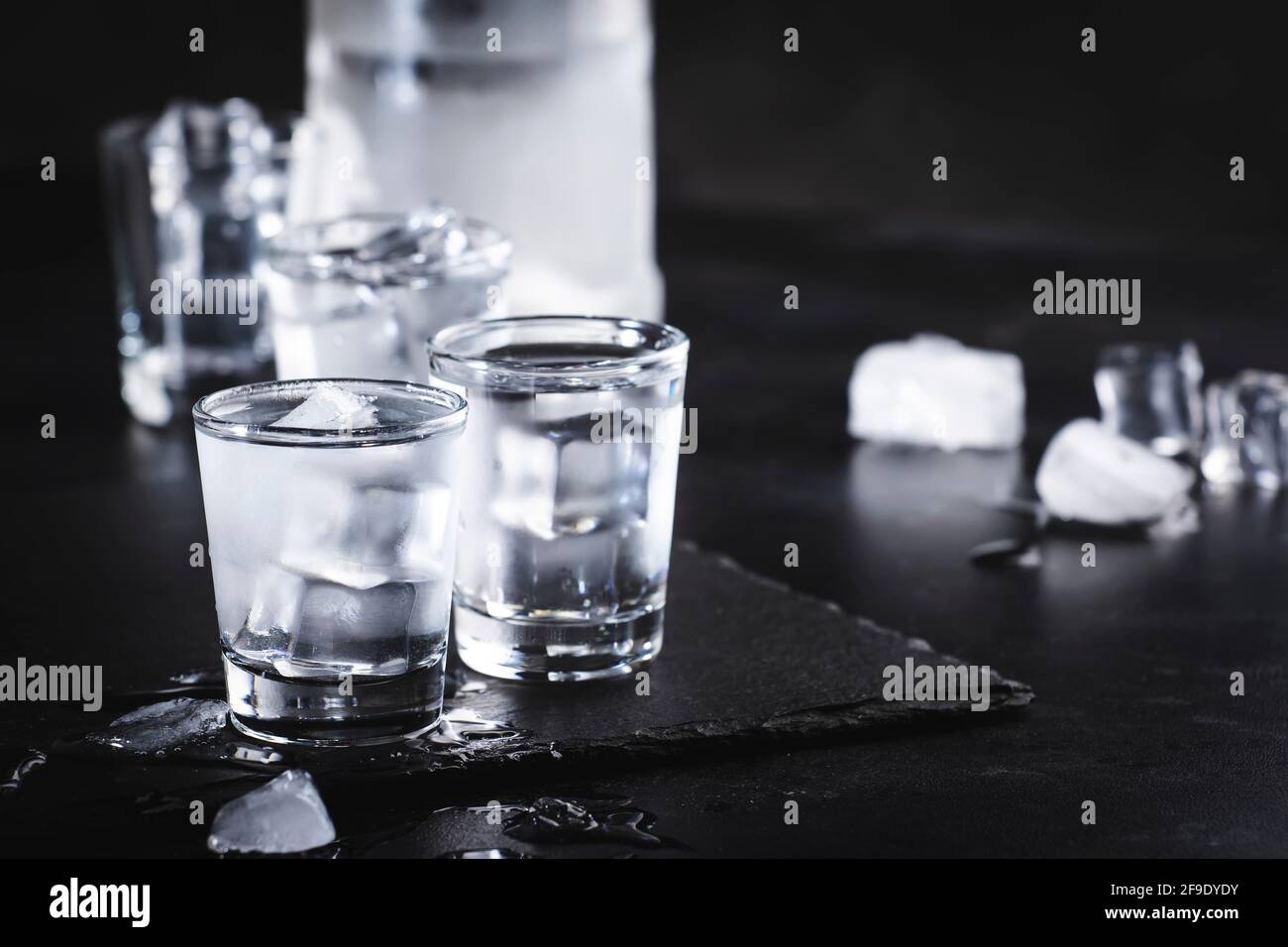 Cold Vodka in shot glasses on black background, ready to drink Stock ...