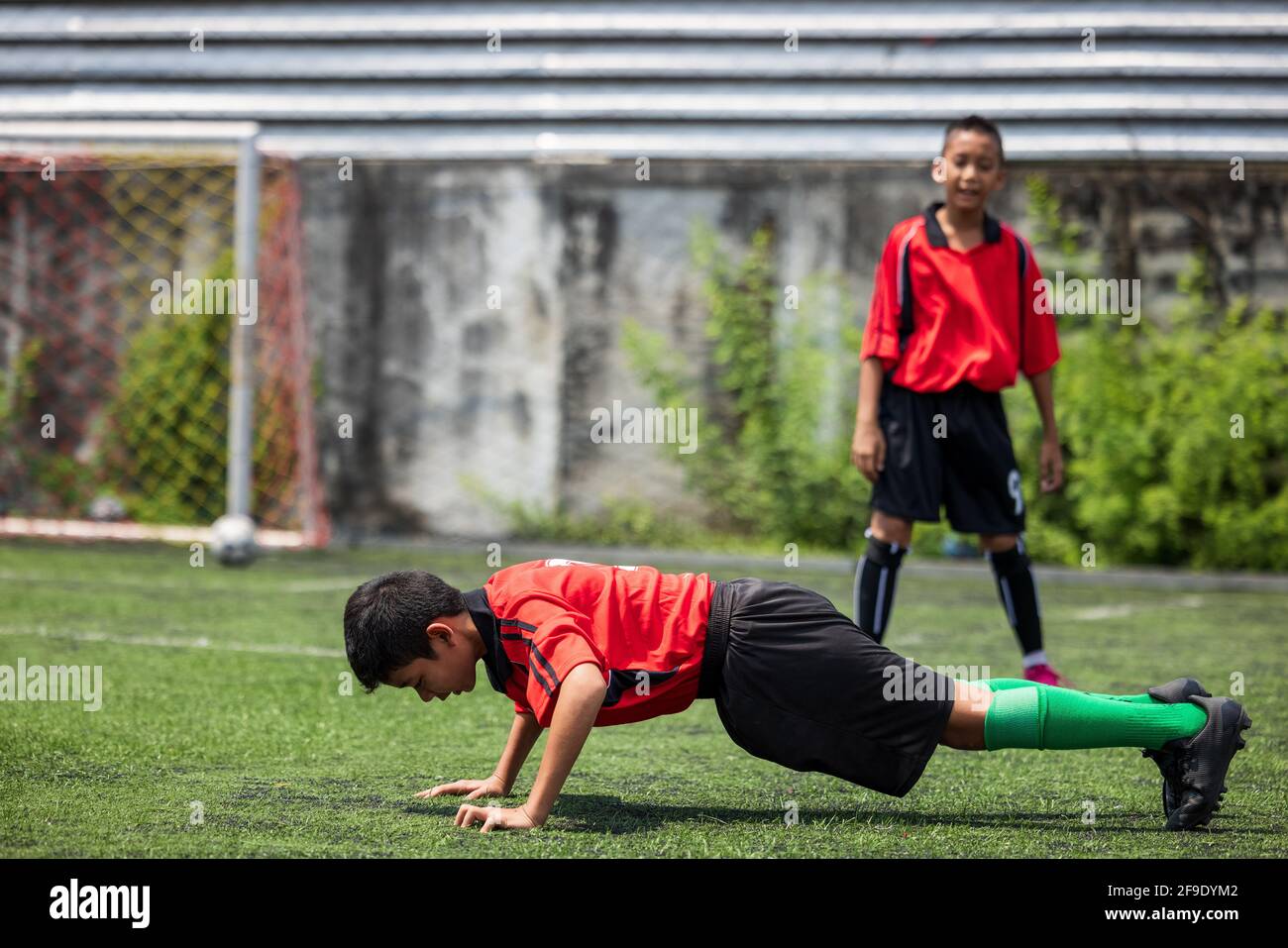 Friend boy teens push up push-ups workout in a grass Stock Photo - Alamy