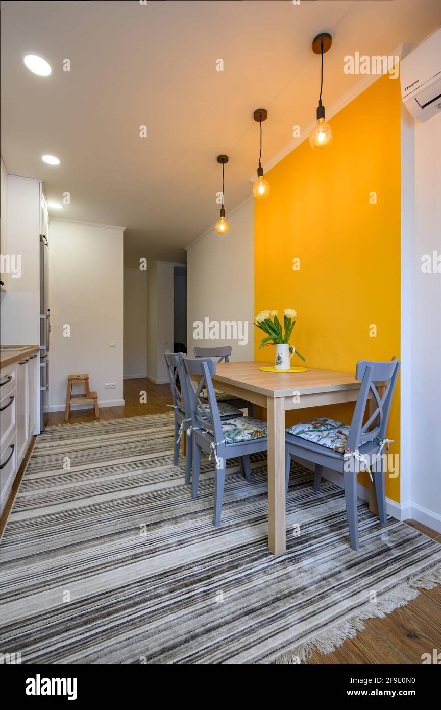 dining table in cozy well designed dining room Stock Photo - Alamy