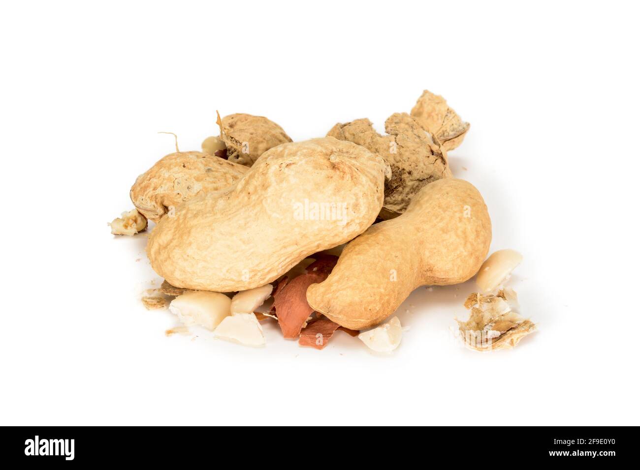 Peanuts. Two whole and one broken nuts by hammer isolated on white ...