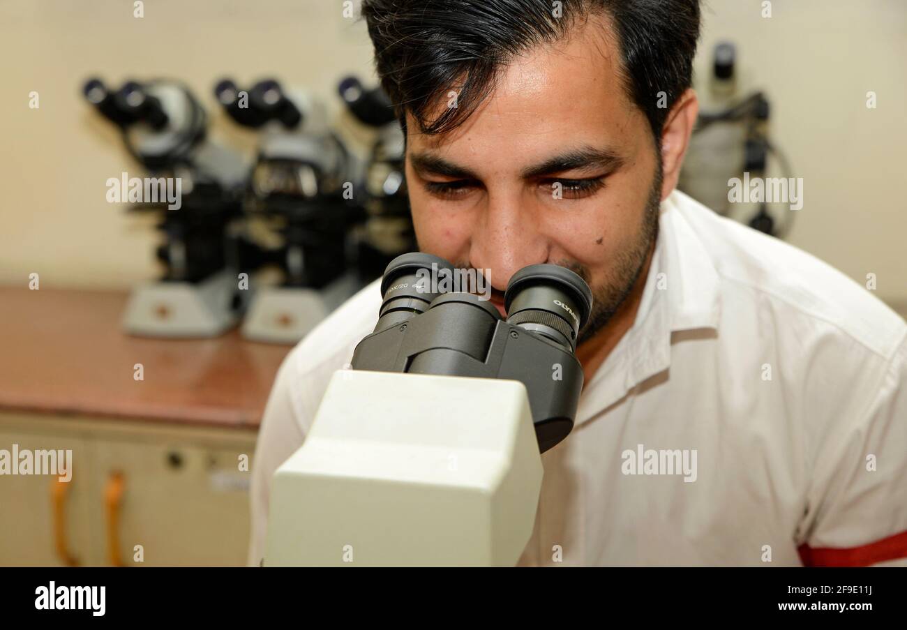 Young Indian student in a lab Stock Photo - Alamy