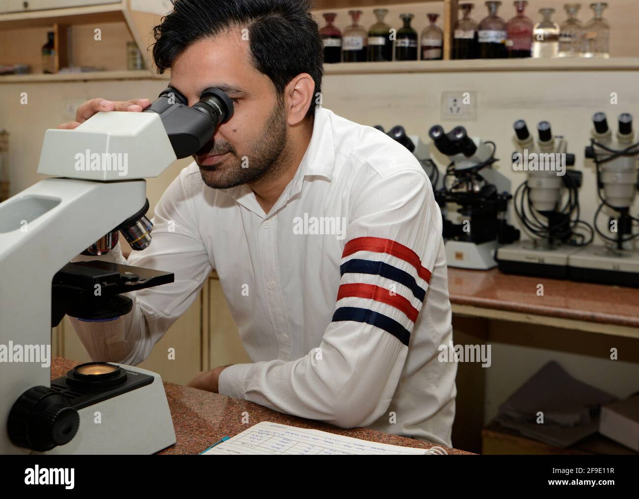 Young Indian student in a lab Stock Photo - Alamy