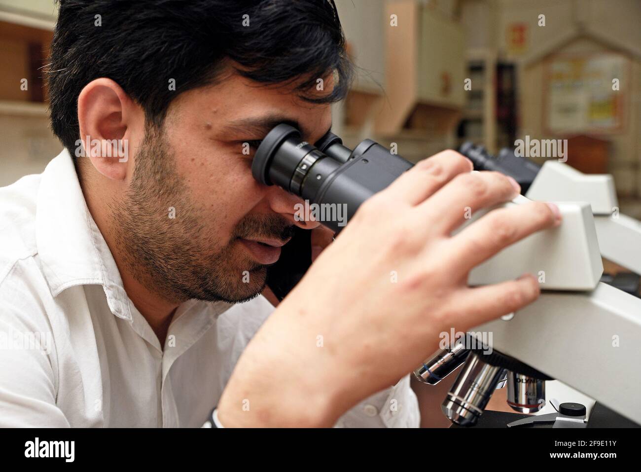 Young Indian student in a lab Stock Photo - Alamy