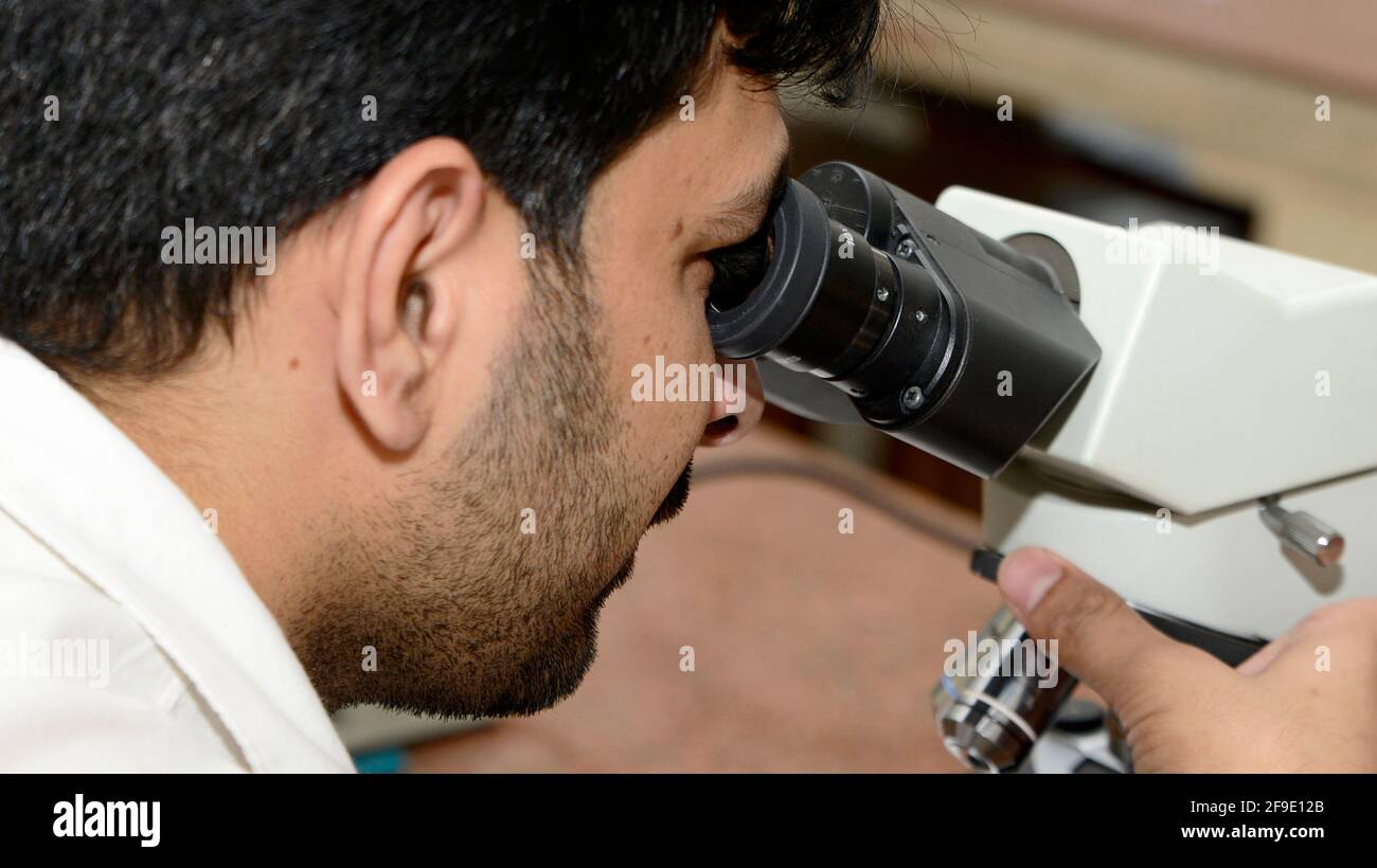 Young Indian student in a lab Stock Photo - Alamy