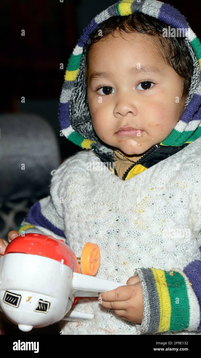 Happy Child Holding Toys Stock Photo - Alamy