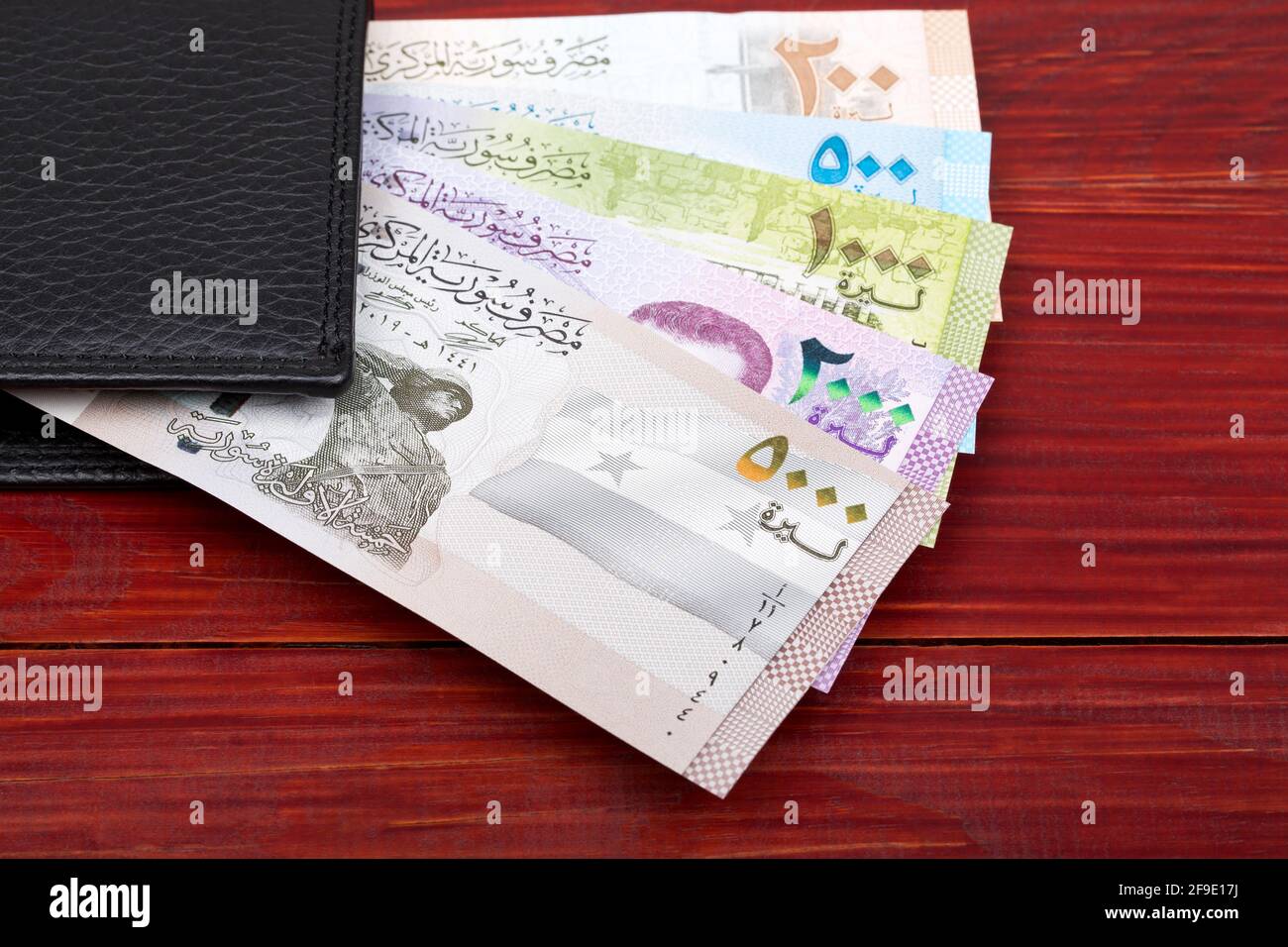 Syrian money - pound in the black wallet Stock Photo - Alamy