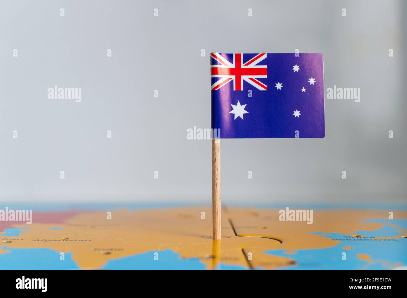 A closeup of a small Australian flag on a world map puzzle Stock Photo ...