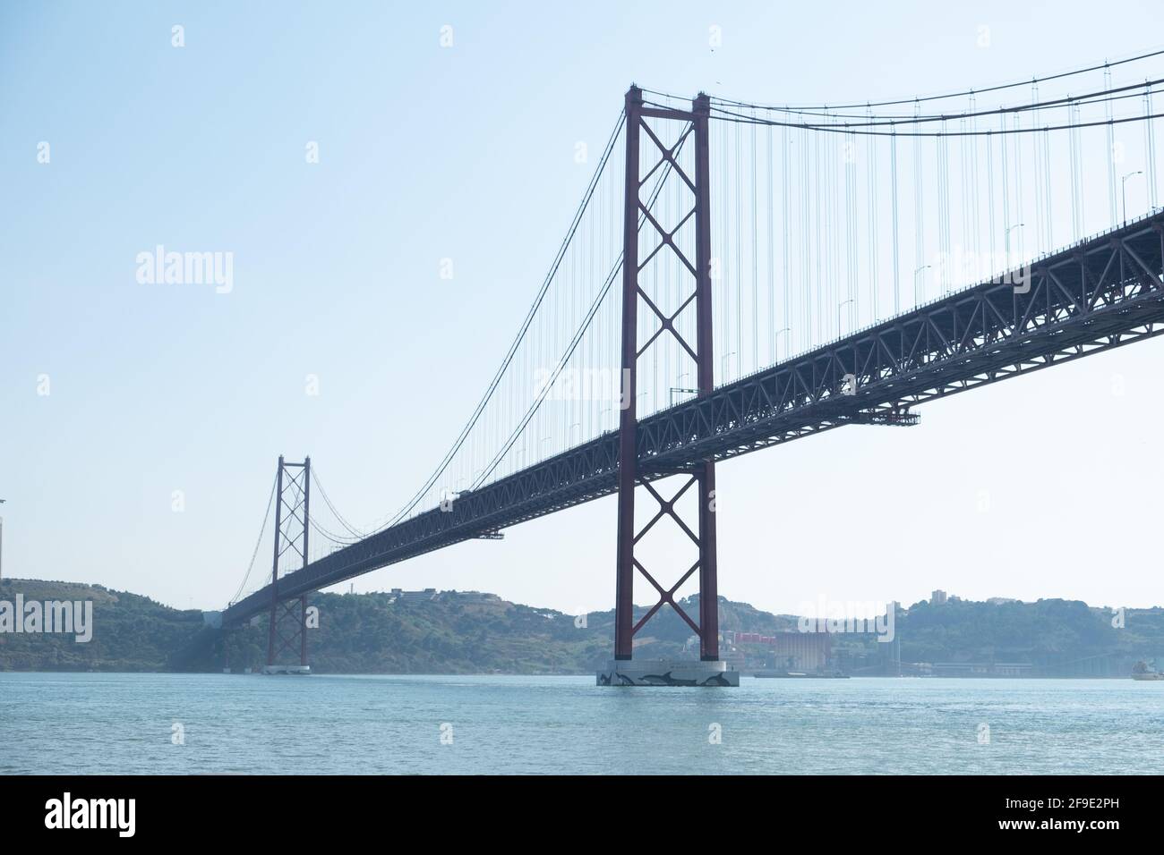 A low angle shot of a suspension bridge in Lisbon, Portugal Stock Photo ...