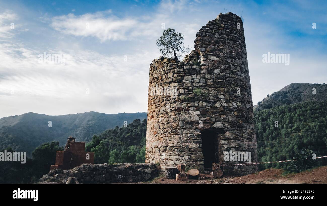 A beautiful ruins of the historic Ain castle in Spain with round ...