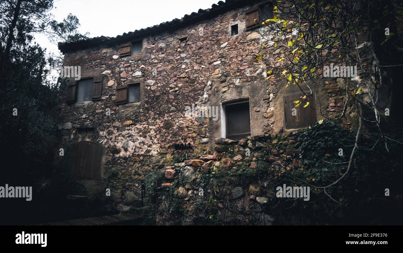A closeup shot of the old building with small irregularly constructed ...