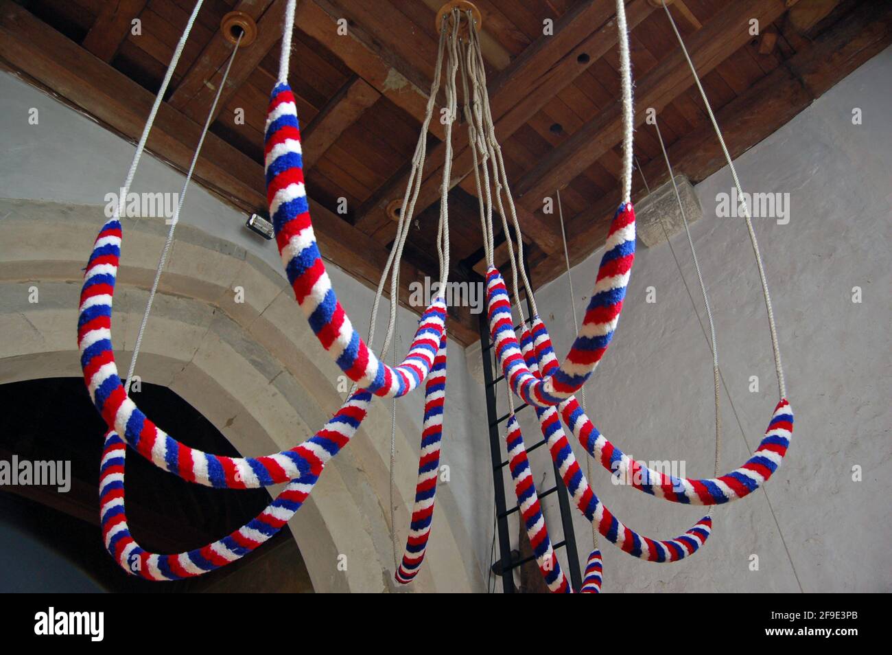 the fluffy parts of ropes used to ring church bells. This church has a ...