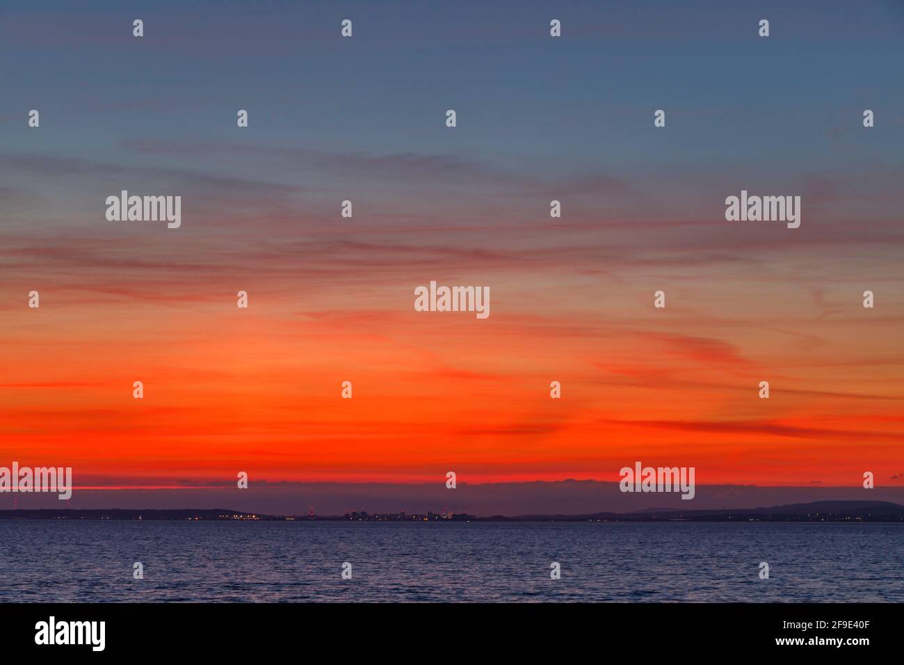 The sun lighting up the cloud cover Stock Photo - Alamy