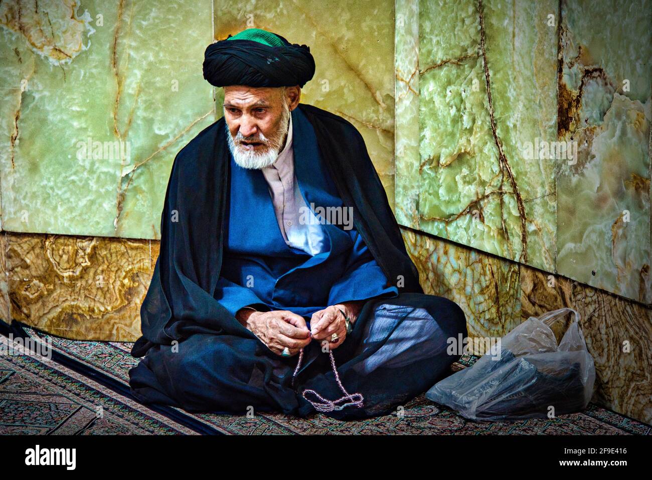 Old imam praying, Imam Zadeh Jafar Mausoleum, Yazd, Iran Stock Photo ...