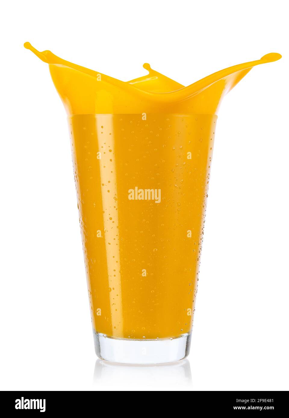 glass of splashing mango juice isolated on white Stock Photo - Alamy