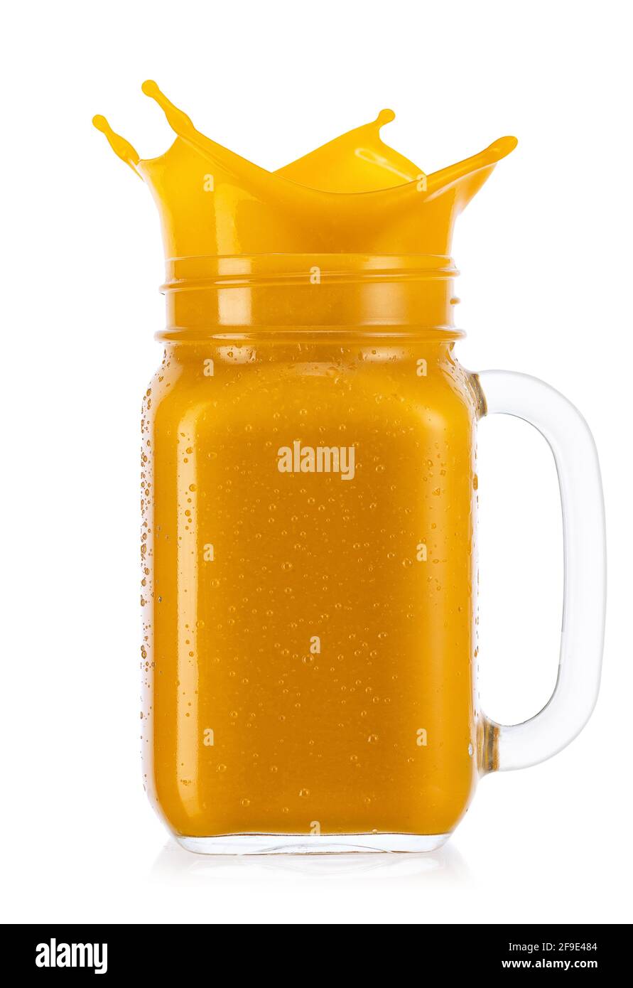 mason jar of splashing mango smoothies isolated on white Stock Photo ...