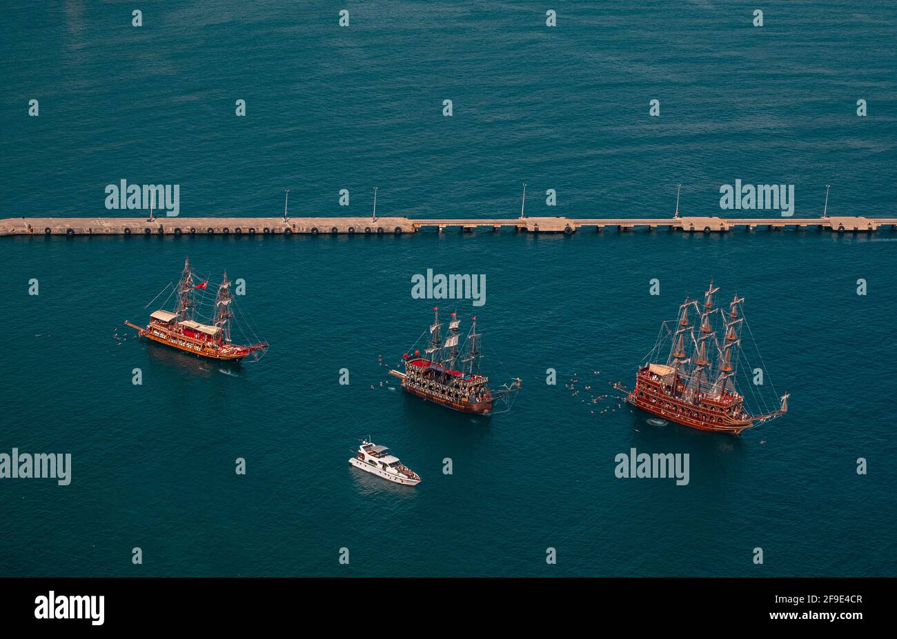 High angle shot of floating vessels and a yacht Stock Photo - Alamy