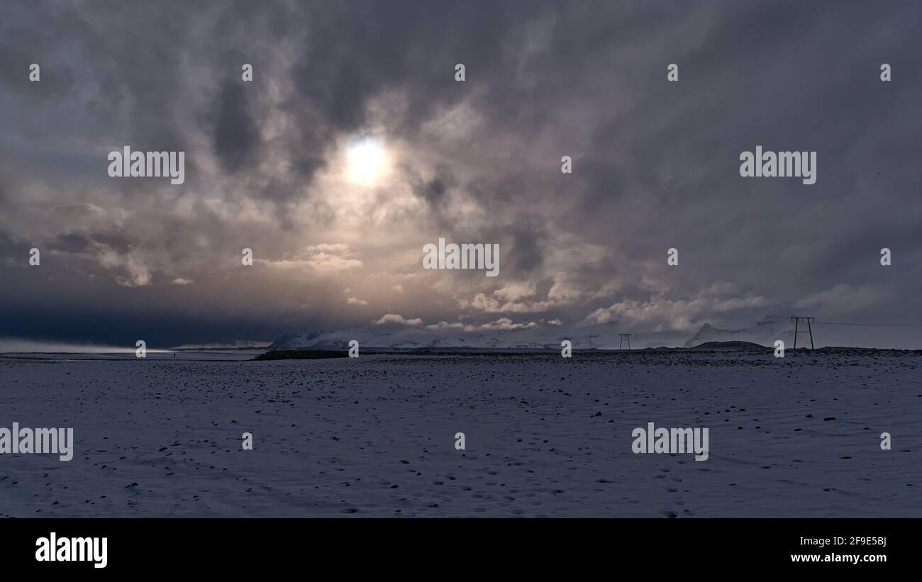 Stunning view of snow-covered landscape with power pylons on the ...