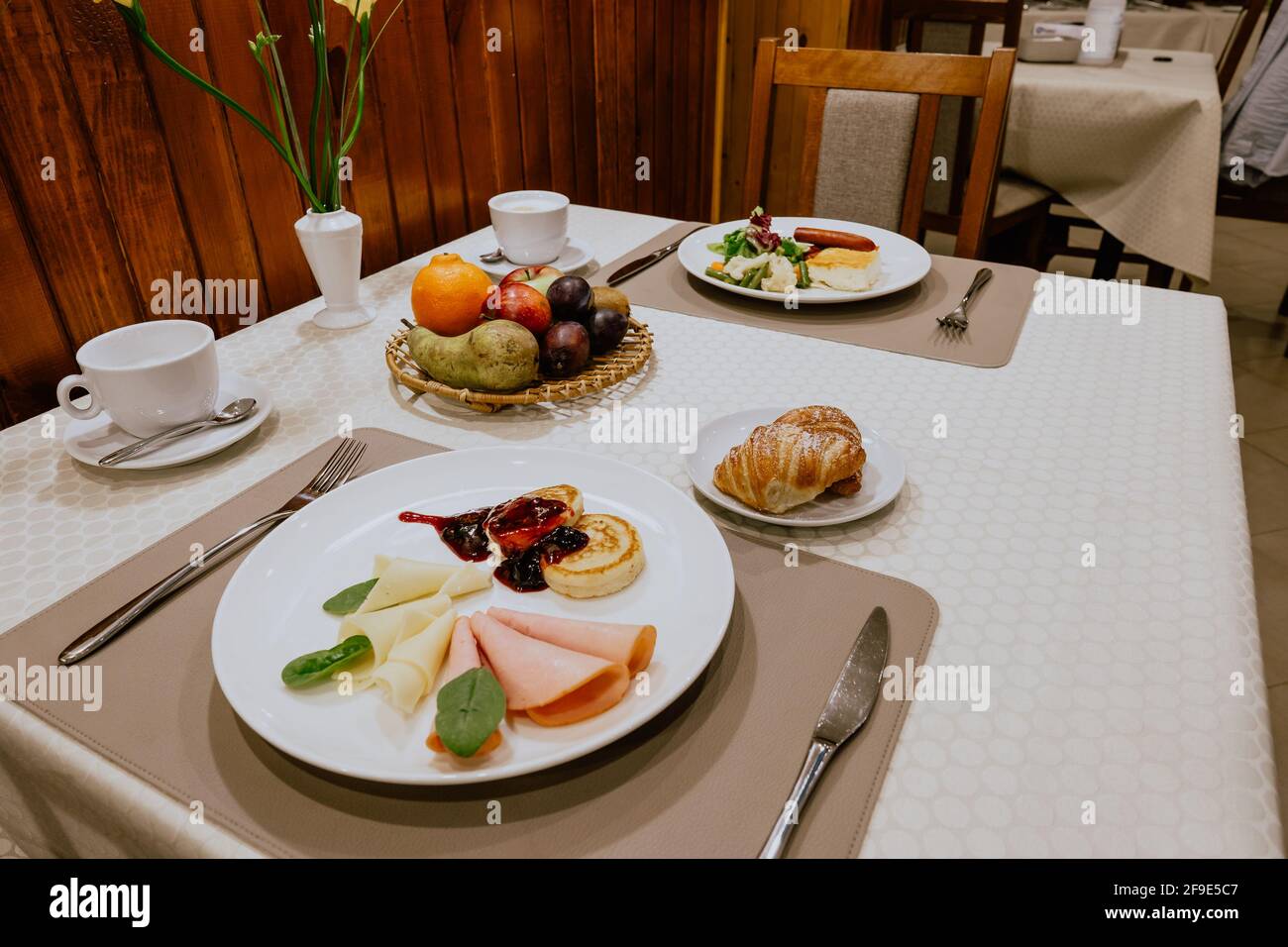 A set table of breakfast for two Stock Photo - Alamy