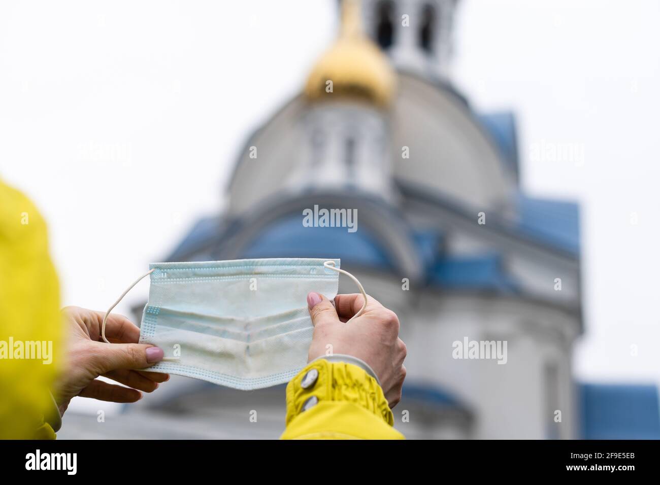 protective mask from coronavirus on the background of the church ...