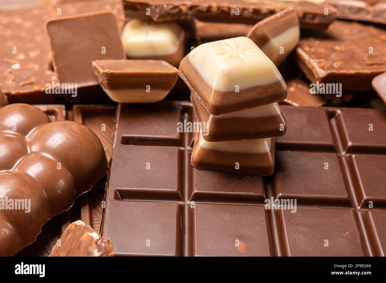 Stacked chocolate bars. dark and milk chocolates with nuts, assorted ...