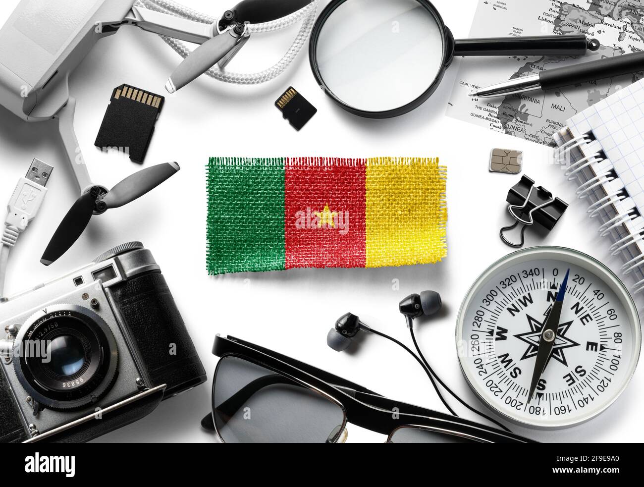 Flag of Cameroon and travel accessories on a white background Stock ...